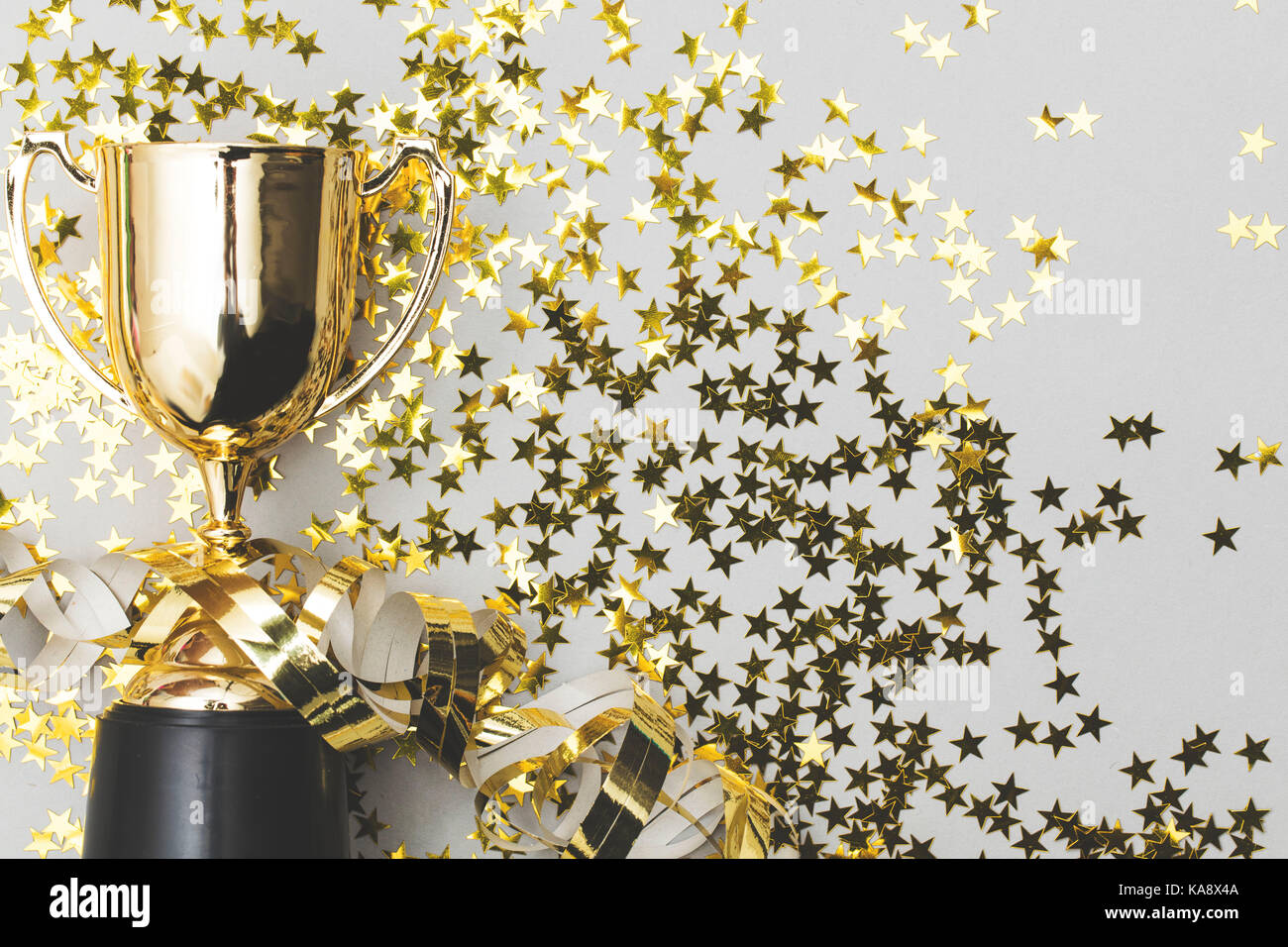 Gold winners trophy with golden shiny stars Stock Photo - Alamy