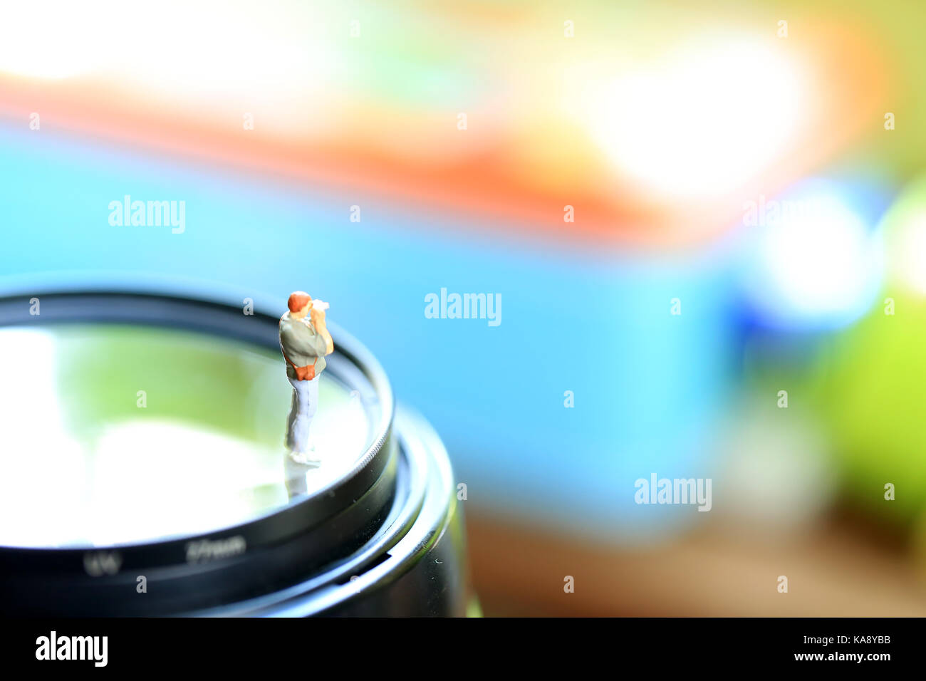 tiny man take photo Stock Photo - Alamy