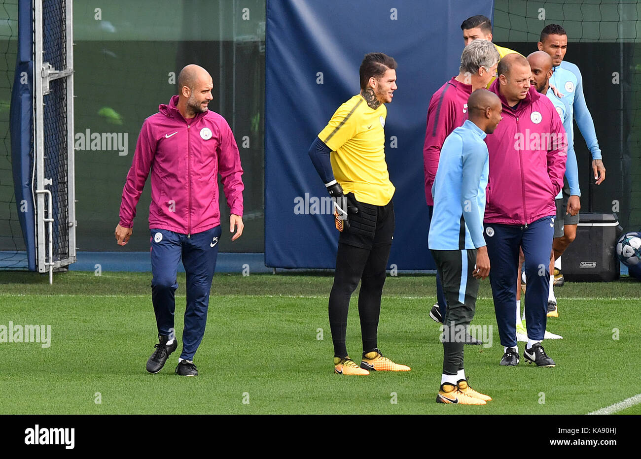 Manchester City manager Pep Guardiola (left) during the training ...