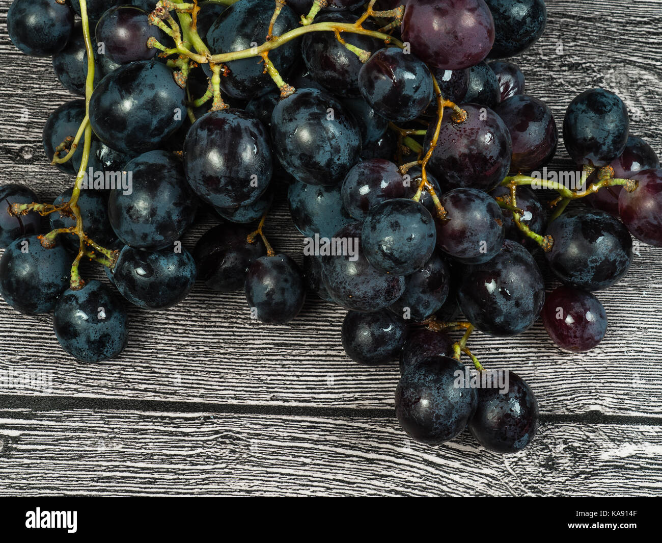 Red grapes on an old wooden table. Healthy balanced food concept Stock ...