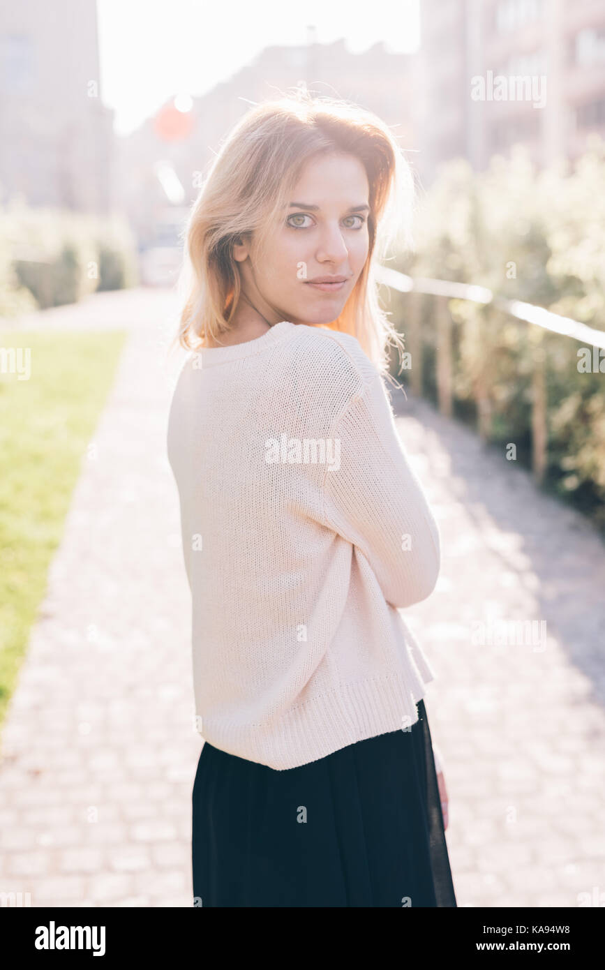Young Woman Outdoor Back Light Posing Looking Camera Smiling Serene