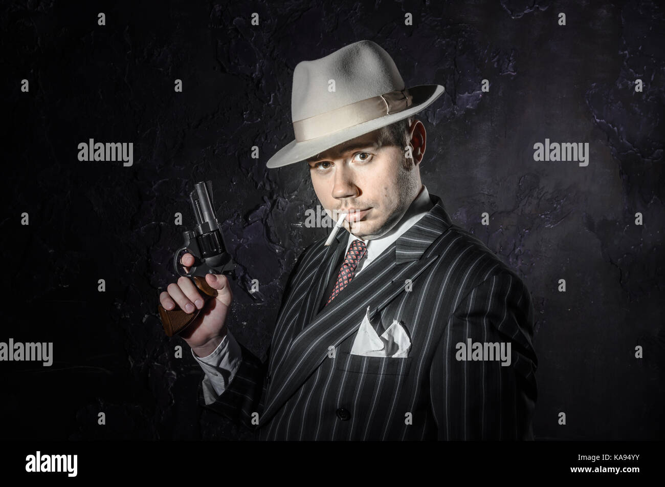 Private detective in old fashion hat smokes a cigarette. Gangster looks ...