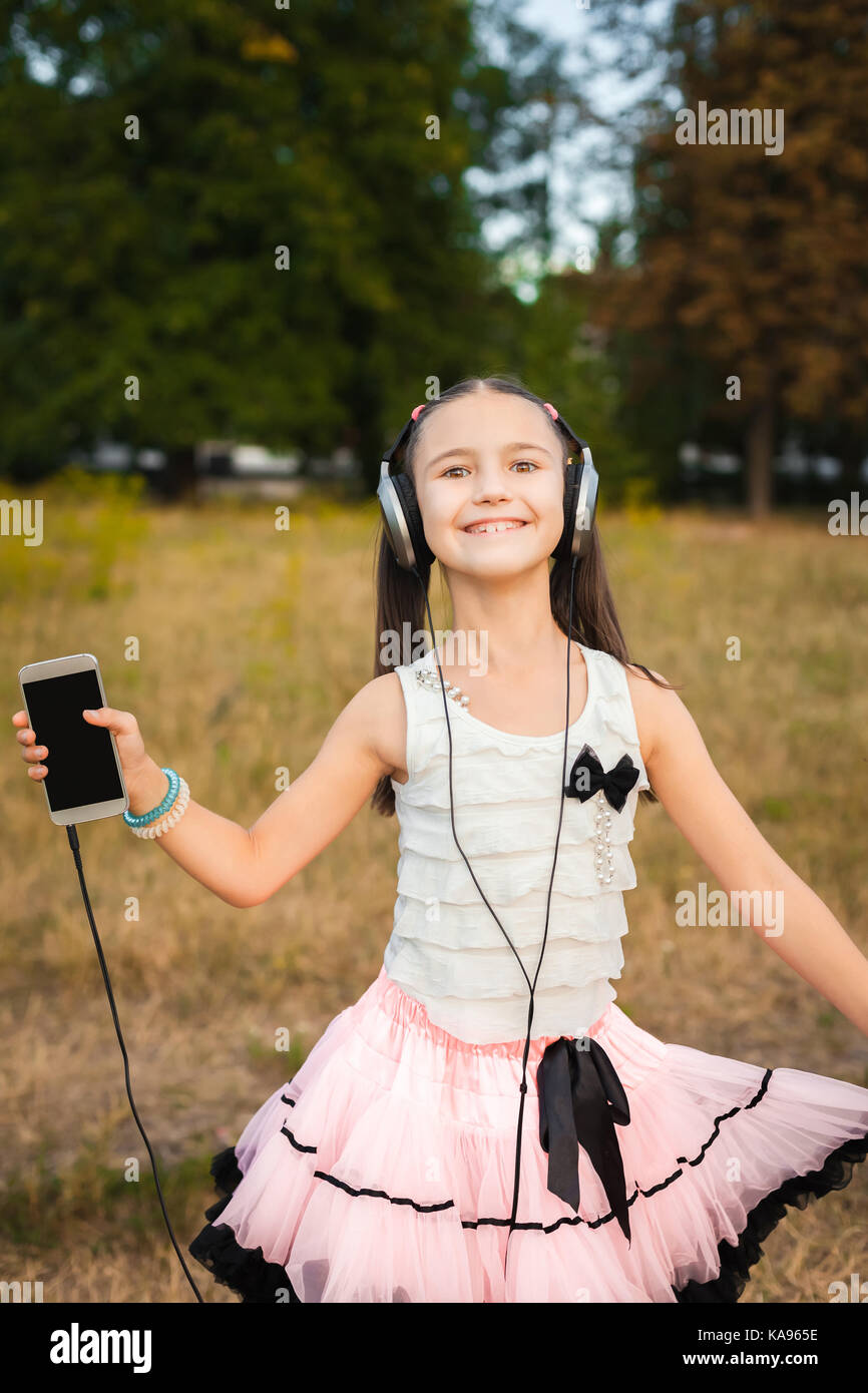 musical girl dancing with headphones Stock Photo - Alamy