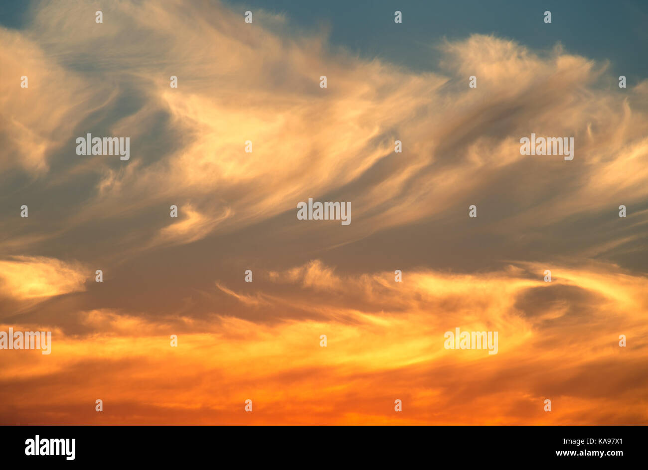 bold abstract cloud swirl design in sunset sky Stock Photo - Alamy