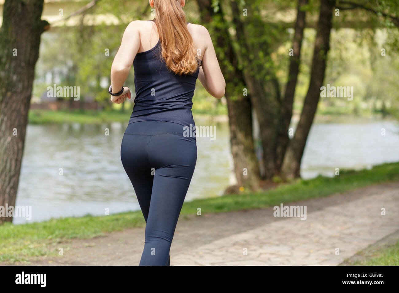 Woman jogging activity tracker hi-res stock photography and images - Alamy