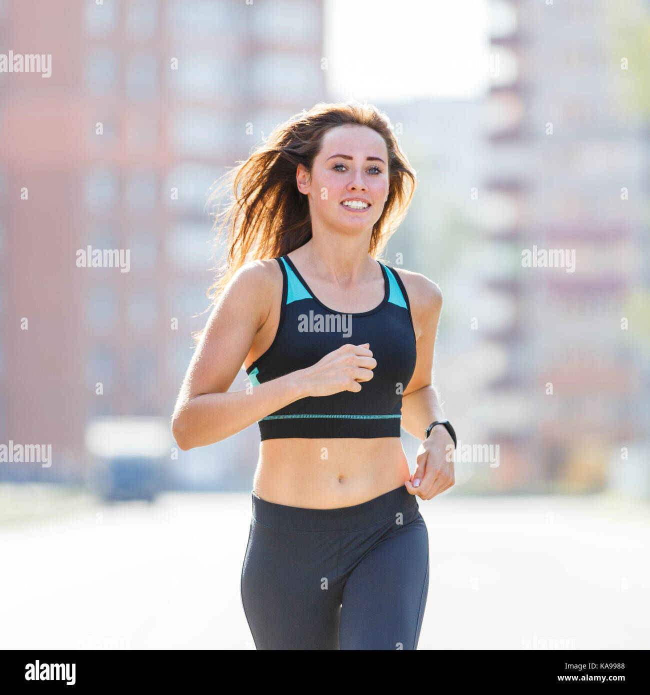 Woman jogging activity tracker hi-res stock photography and images - Alamy