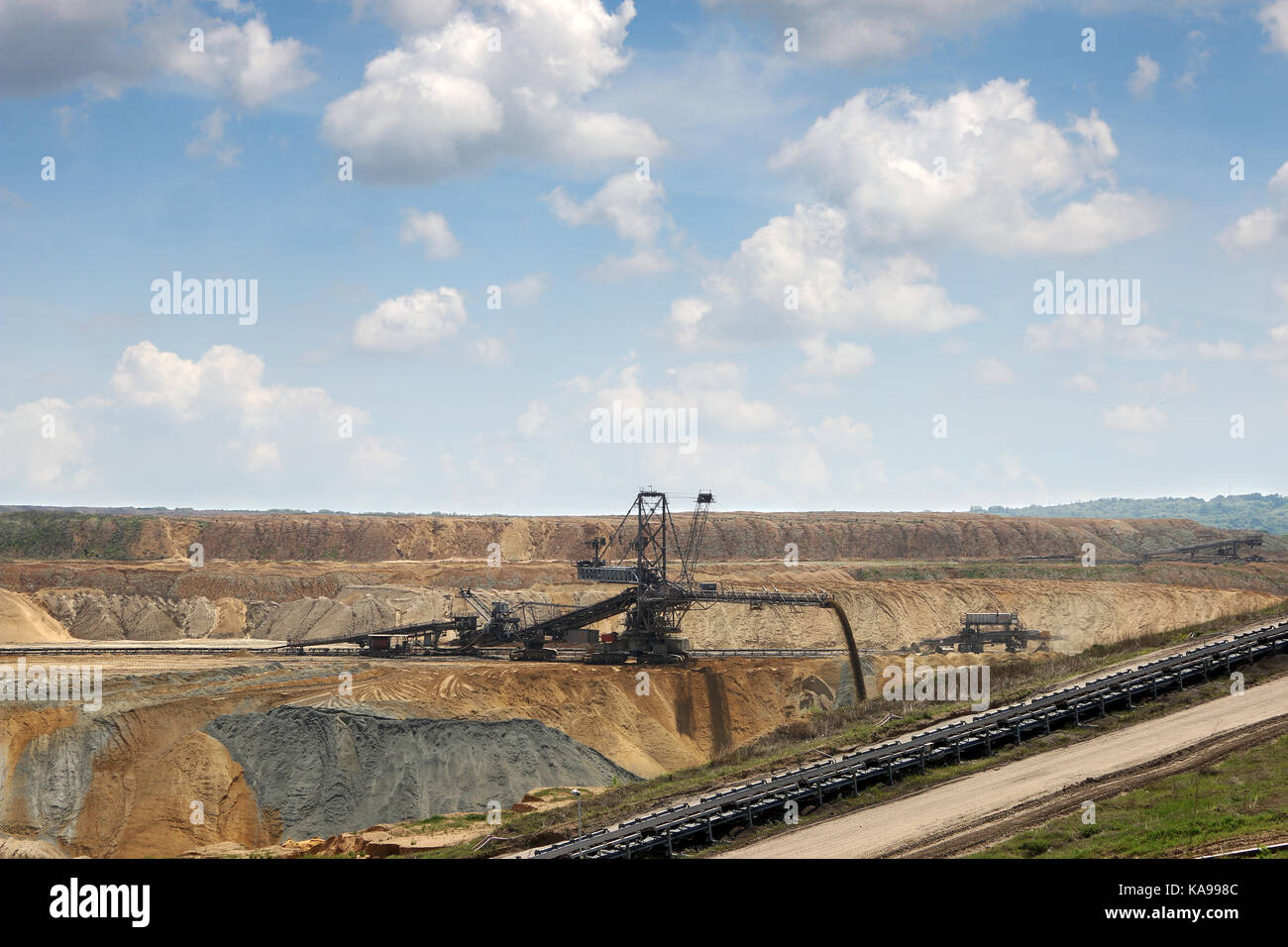 excavator digging on open pit coal mine Stock Photo - Alamy
