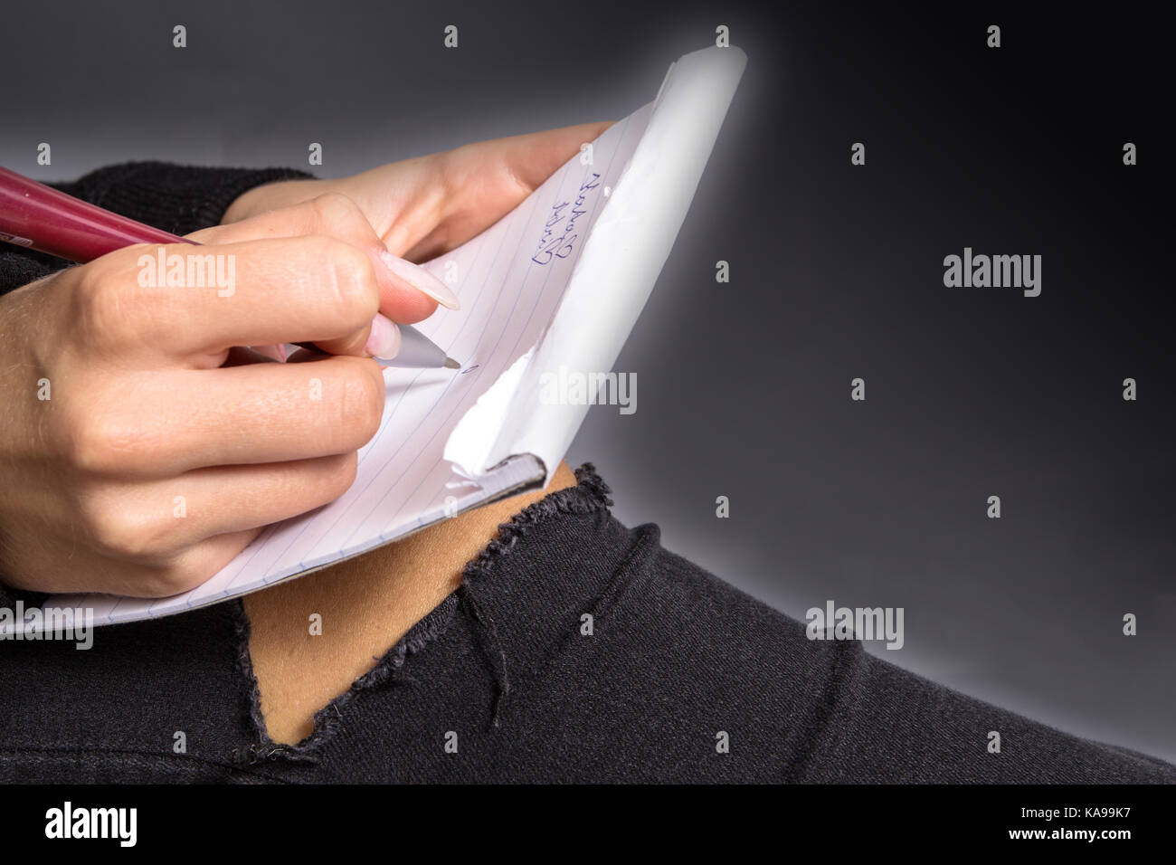 Female hands are writing a message Stock Photo - Alamy