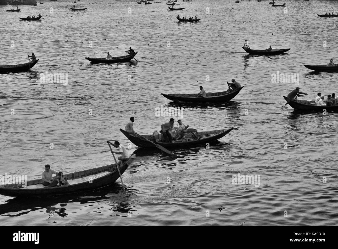 Boats ferrying people and goods in river Buriganga, Dhaka Stock Photo ...