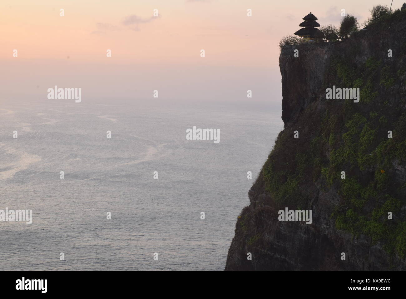 Sunset at Uluwatu hindu temple in Bali, Indonesia Stock Photo - Alamy