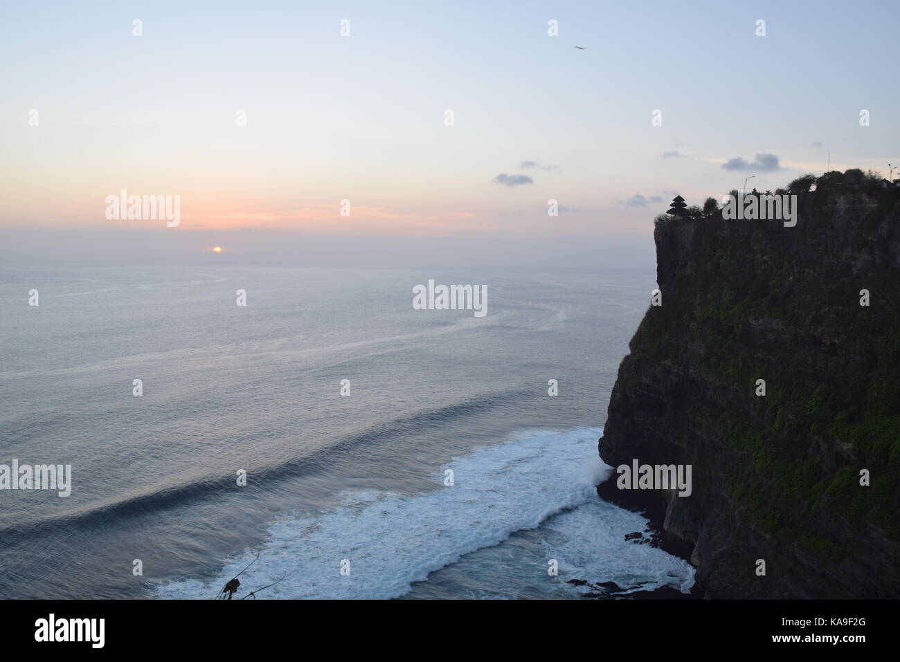 Sunset at Uluwatu hindu temple in Bali, Indonesia Stock Photo - Alamy