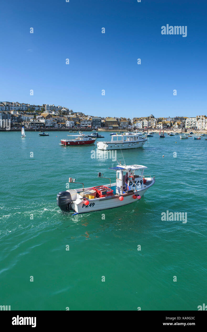 St Ives fishing industry - a small fishing boat entering the old St ...