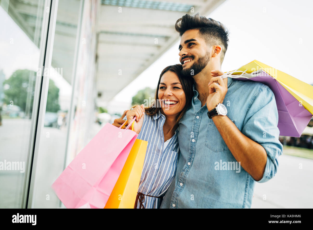 Happy attractive loving couple enjoy shopping together Stock Photo - Alamy