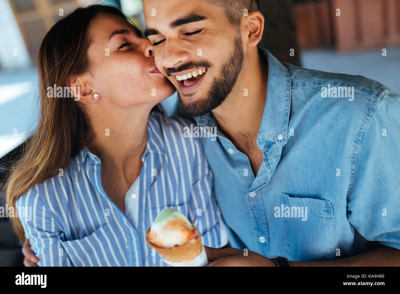 Happy couple having date and eating ice cream Stock Photo - Alamy