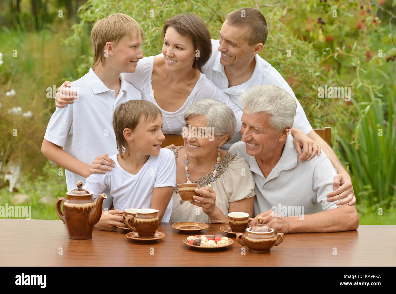 happy family drinking tea Stock Photo - Alamy