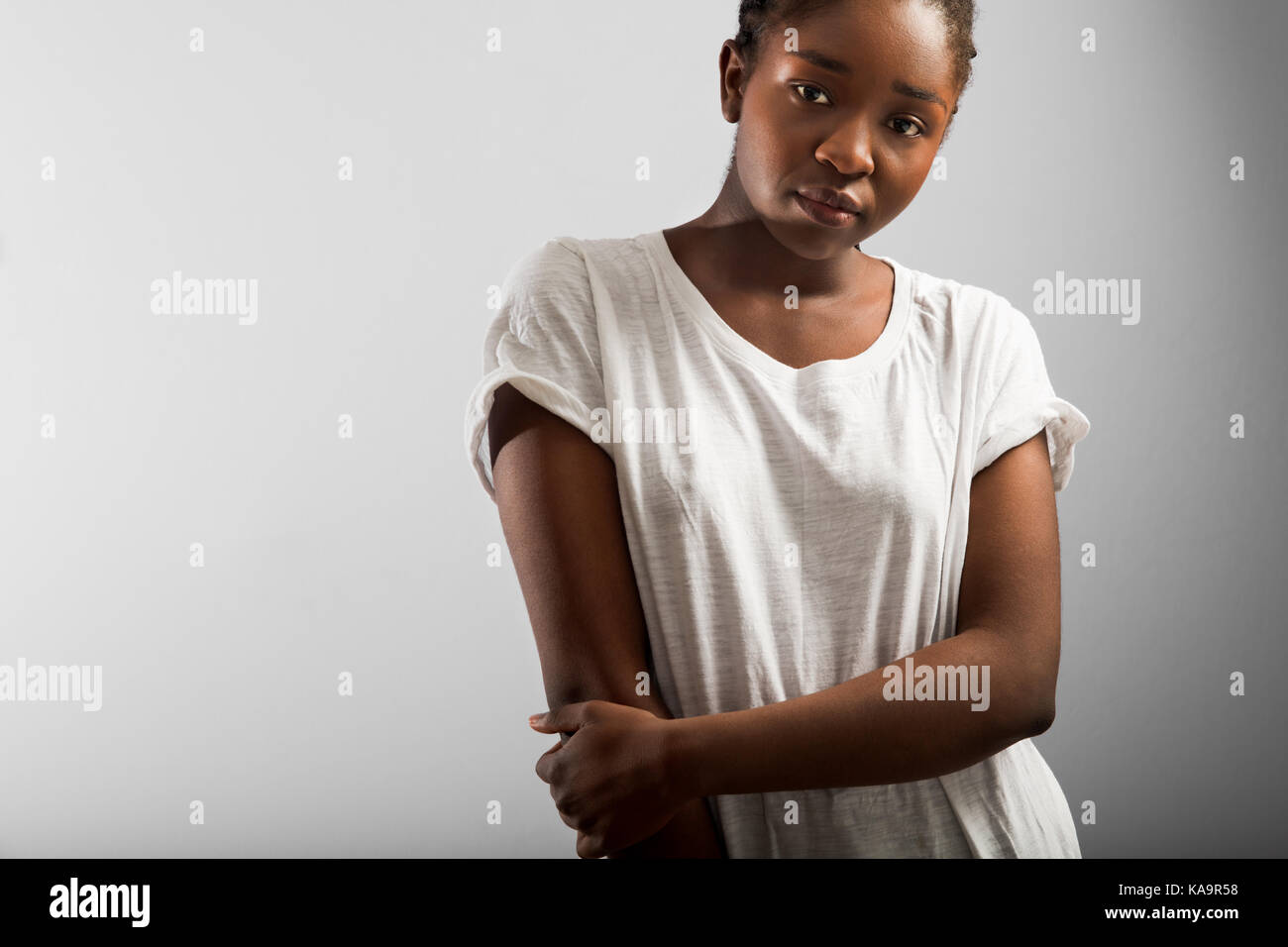 Woman Standing Over Gray Background Stock Photo - Alamy