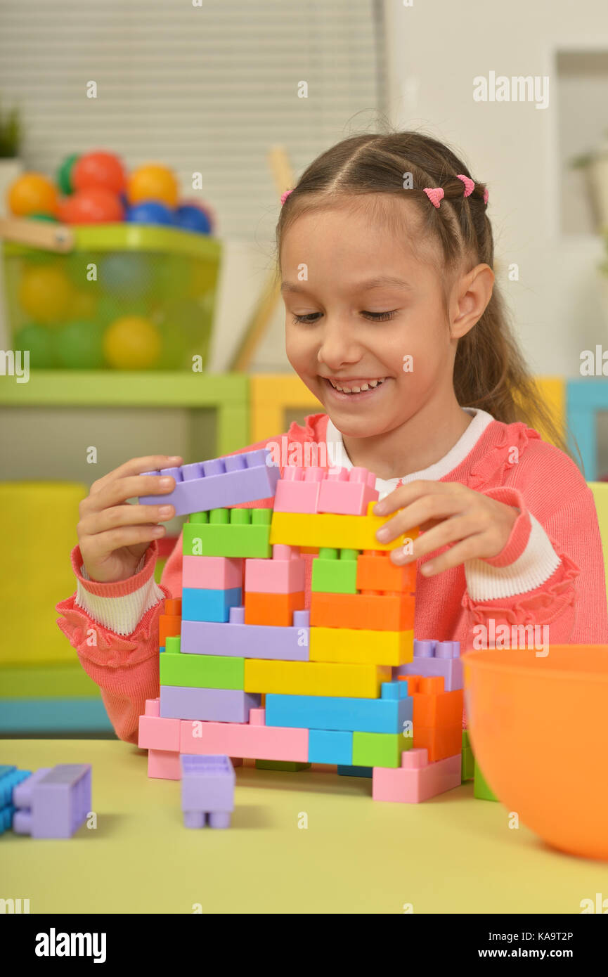 girl playing with plastic blocks Stock Photo - Alamy