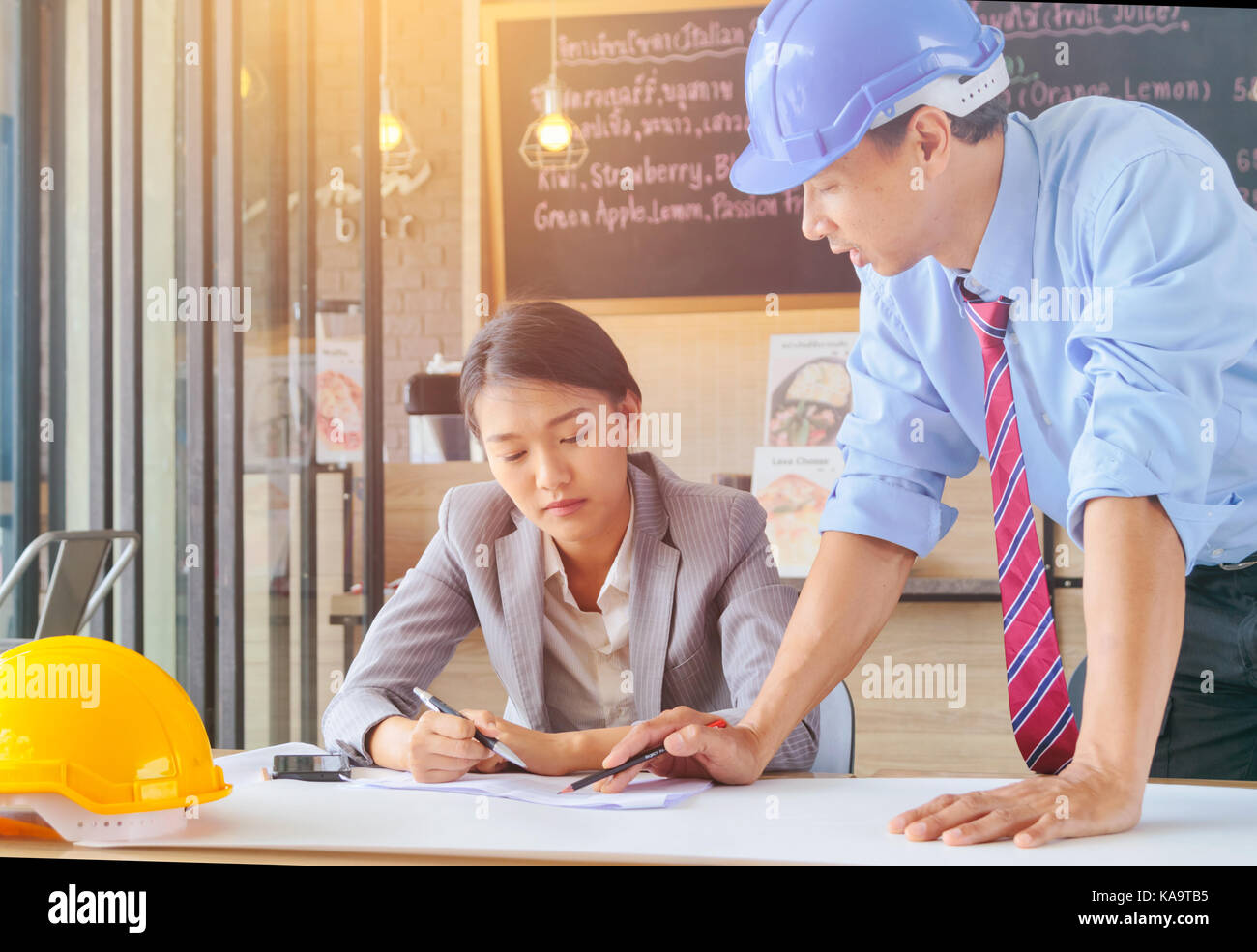 Boss encourages the staff to do a very good job Stock Photo - Alamy