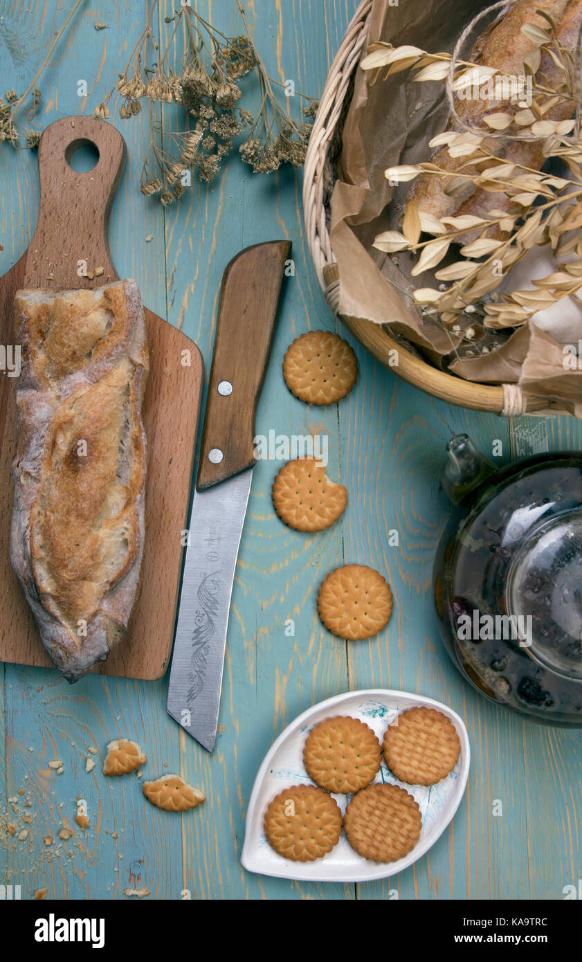 Bread, knife and crackers on the table Stock Photo - Alamy