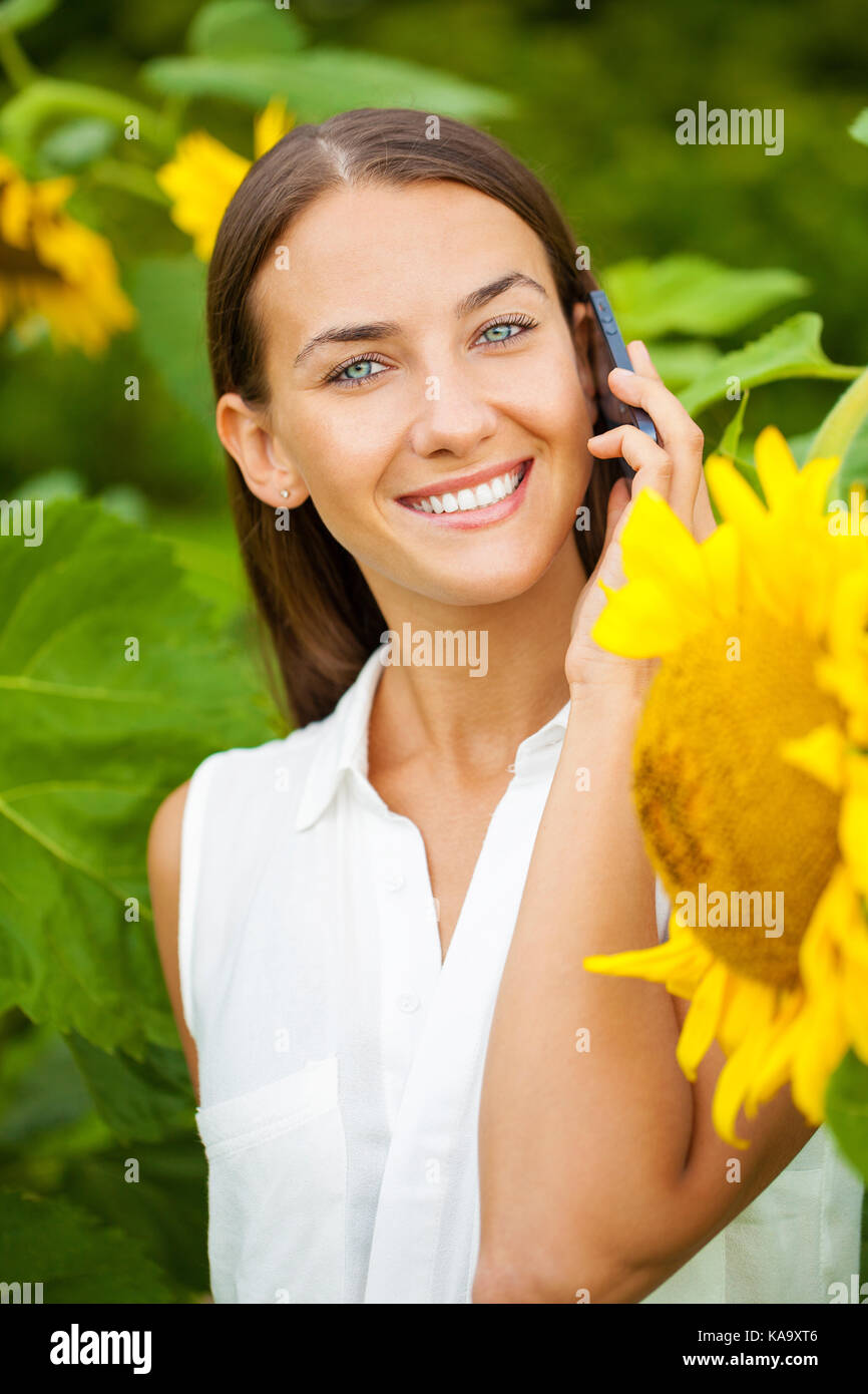 Happy young woman calling by phone. Close up portrait of beautiful ...