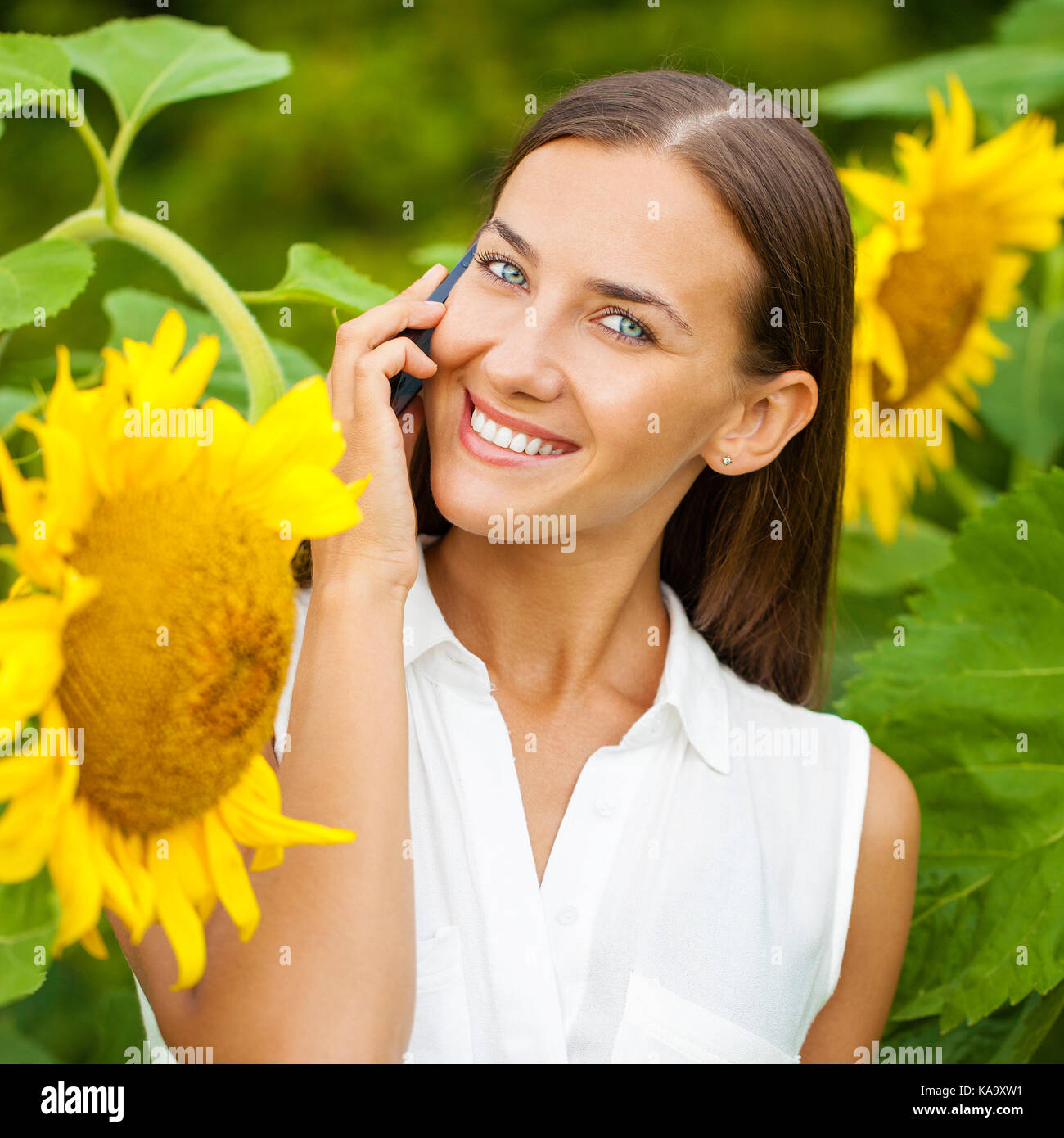 Happy young woman calling by phone. Close up portrait of beautiful ...