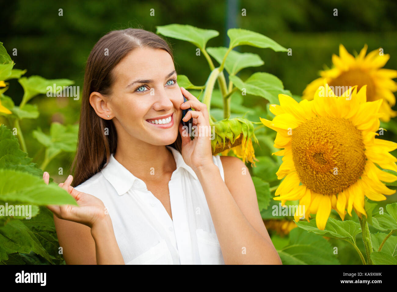 Happy young woman calling by phone. Close up portrait of beautiful ...