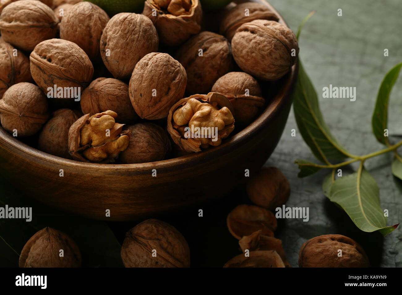 Walnut in wood bowl, food closeup Stock Photo - Alamy