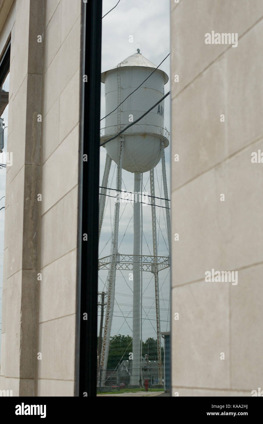 Reflection of water tower in a glass window Stock Photo - Alamy