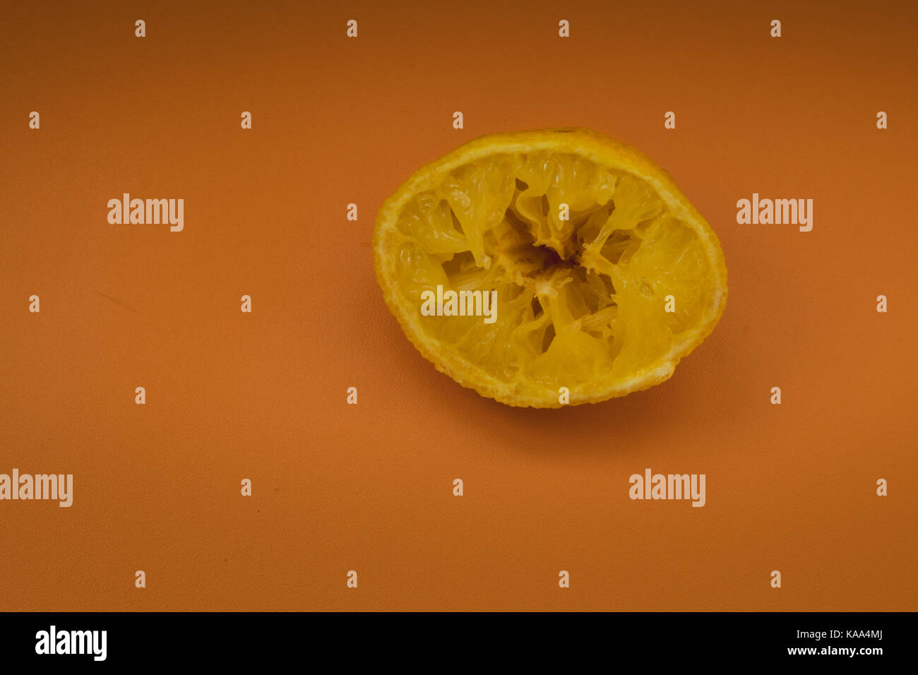 Used lemon on wood background. Vintage look Stock Photo - Alamy