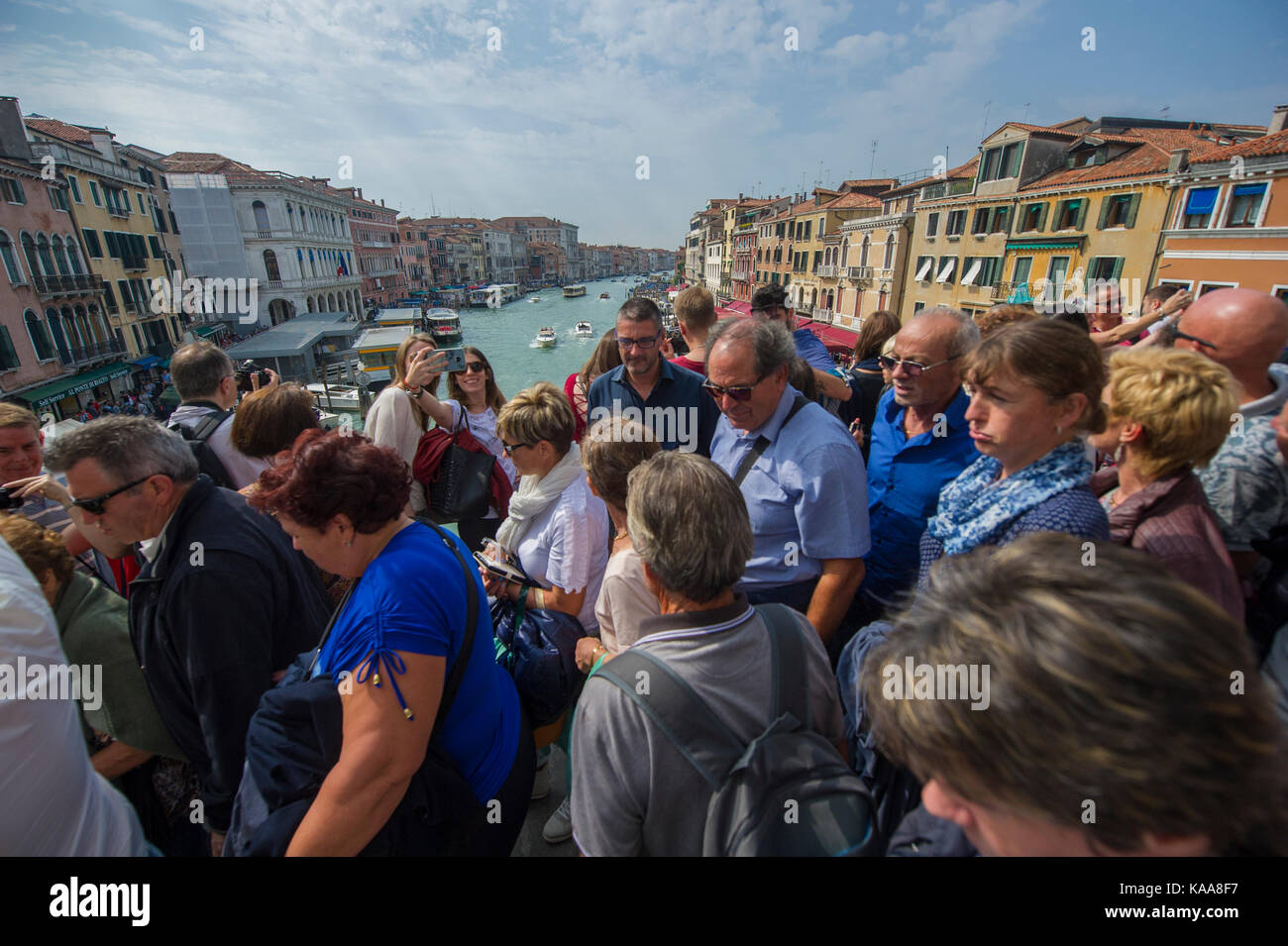 A ridiculously crowded Rialto Bridge in Venice with tourists packed ...