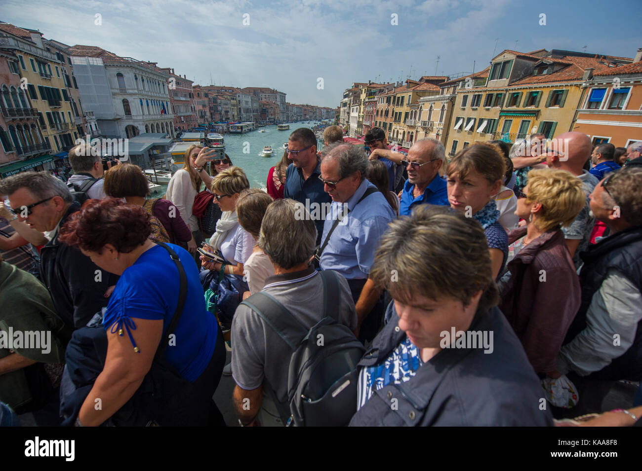A ridiculously crowded Rialto Bridge in Venice with tourists packed ...