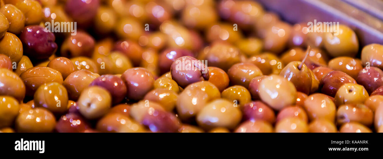 Close up view at green olives background Stock Photo - Alamy