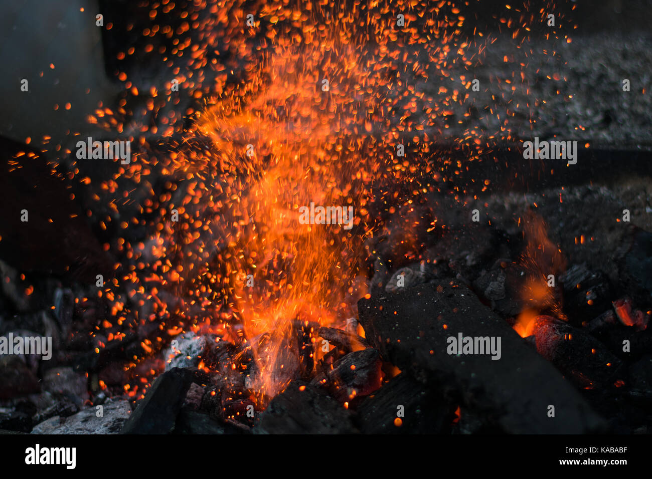 An explosion of sparks and flames Stock Photo - Alamy