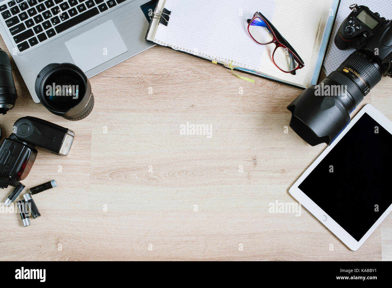Photography office desk table with computer, tablet, supplies and ...