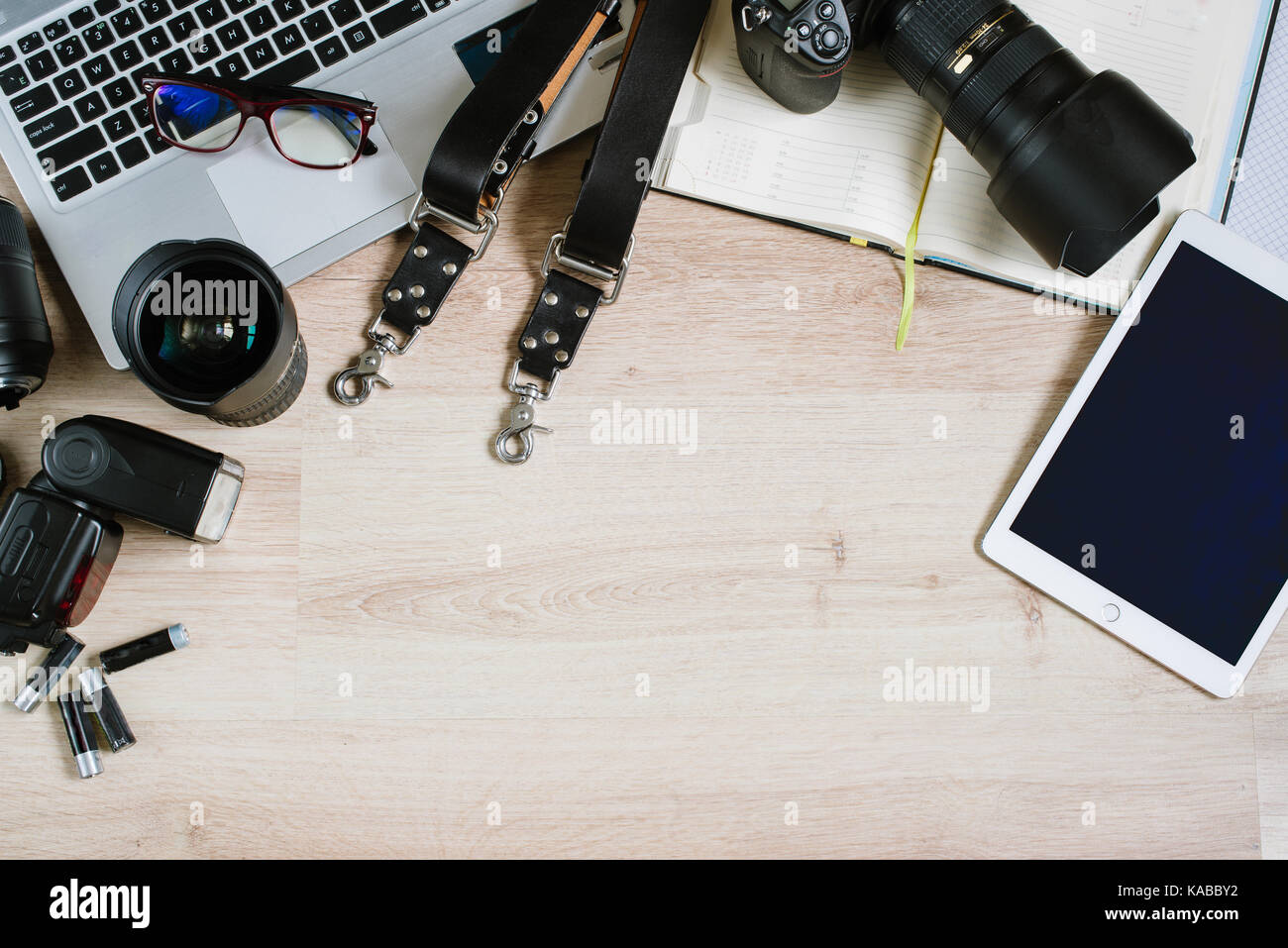 Photography office desk table with computer, tablet, supplies and ...