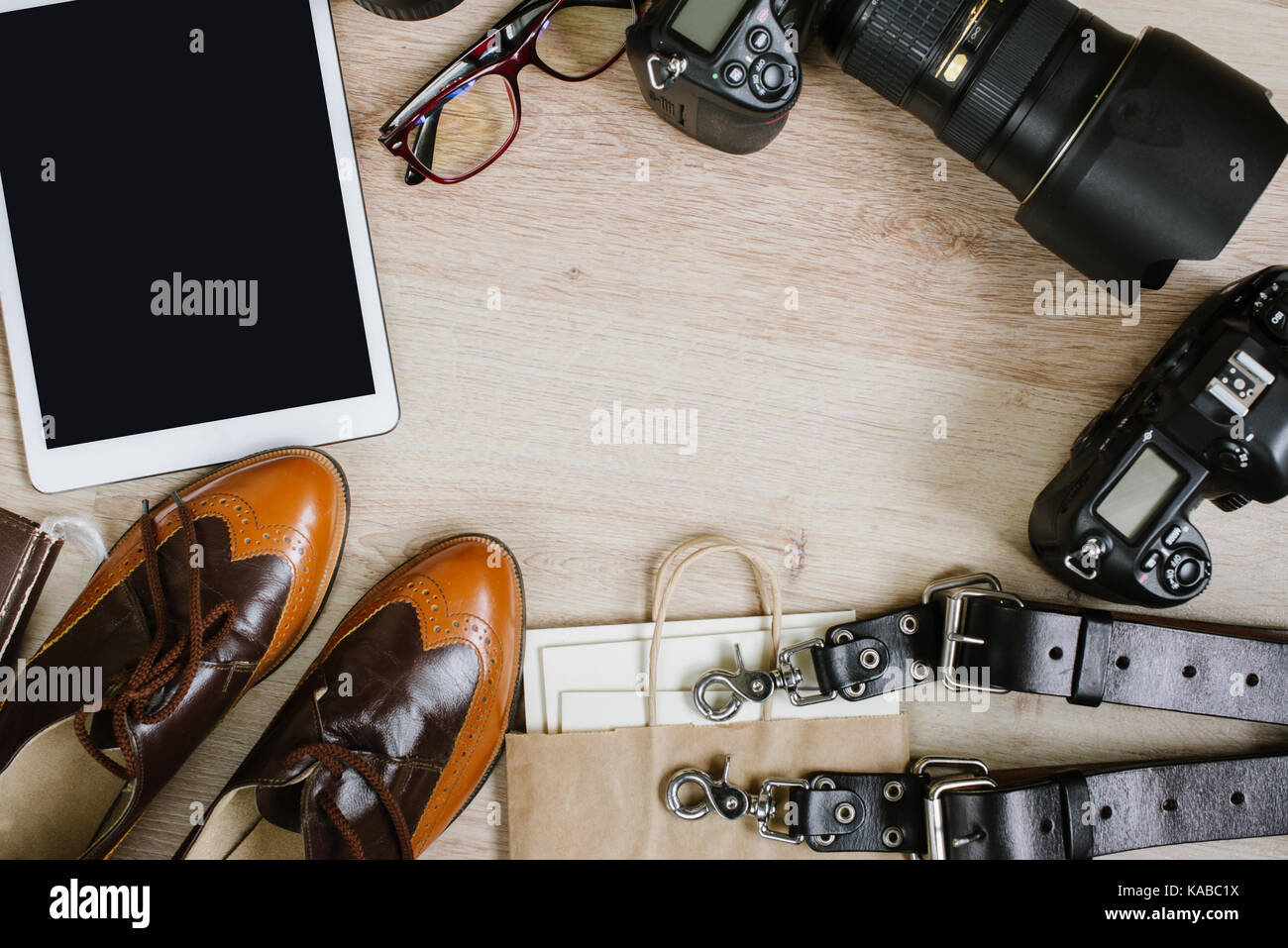Photography hipster work table set with tablet, film, vintage shoes ...