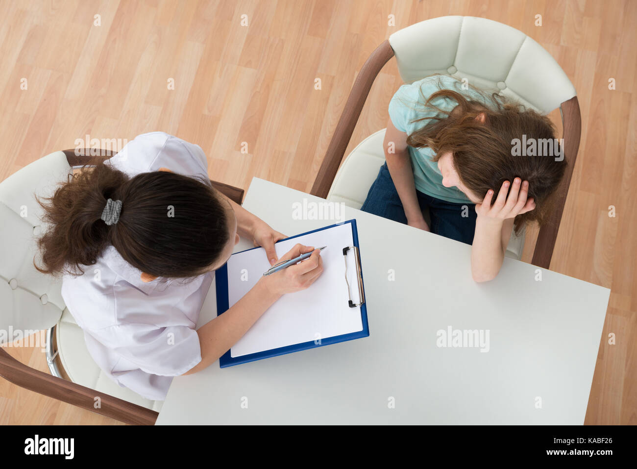 Depressed patient at doctor hi-res stock photography and images - Alamy
