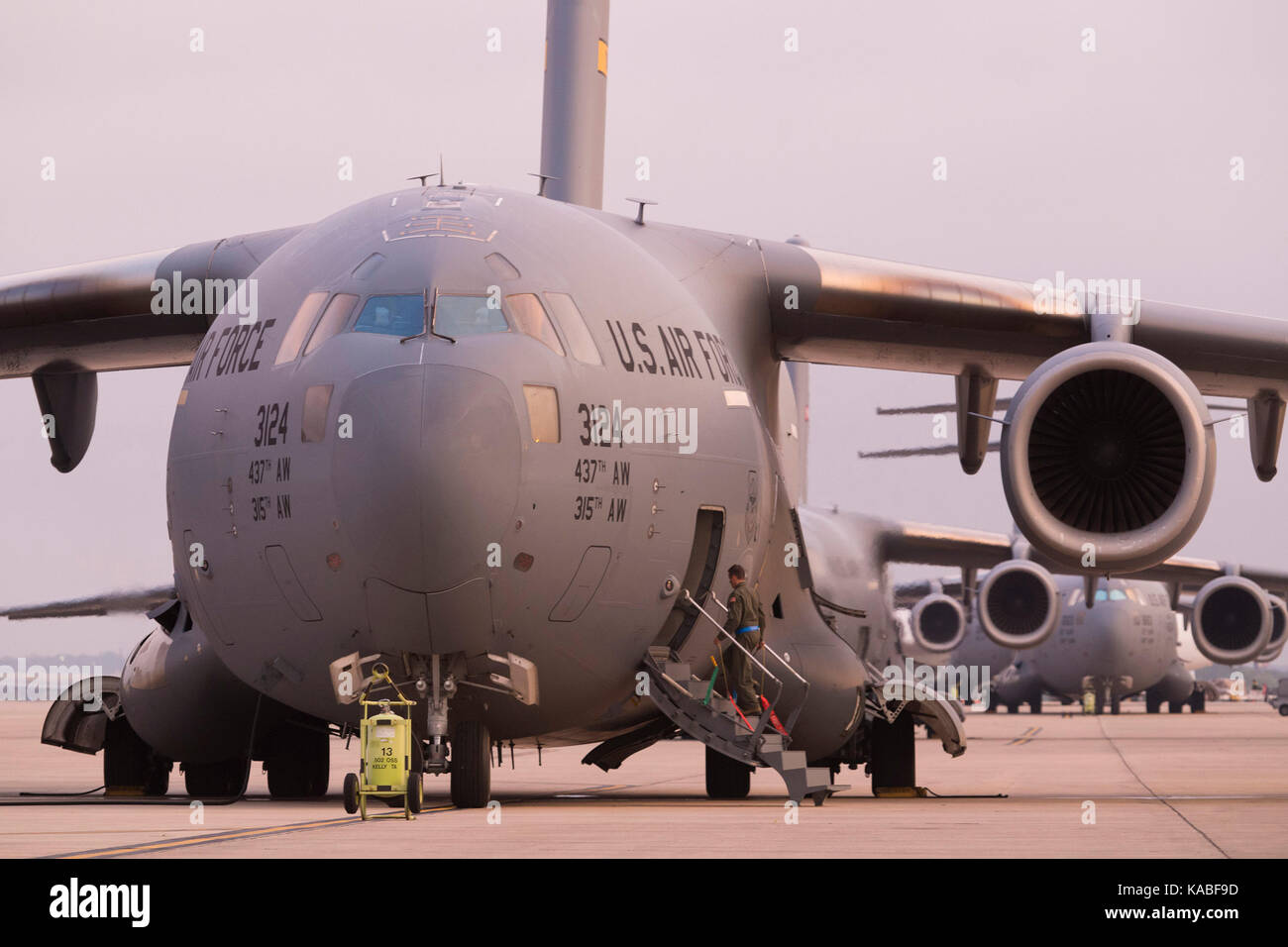 Members from 502nd Logistics Readiness Squadron load supplies onto a C ...