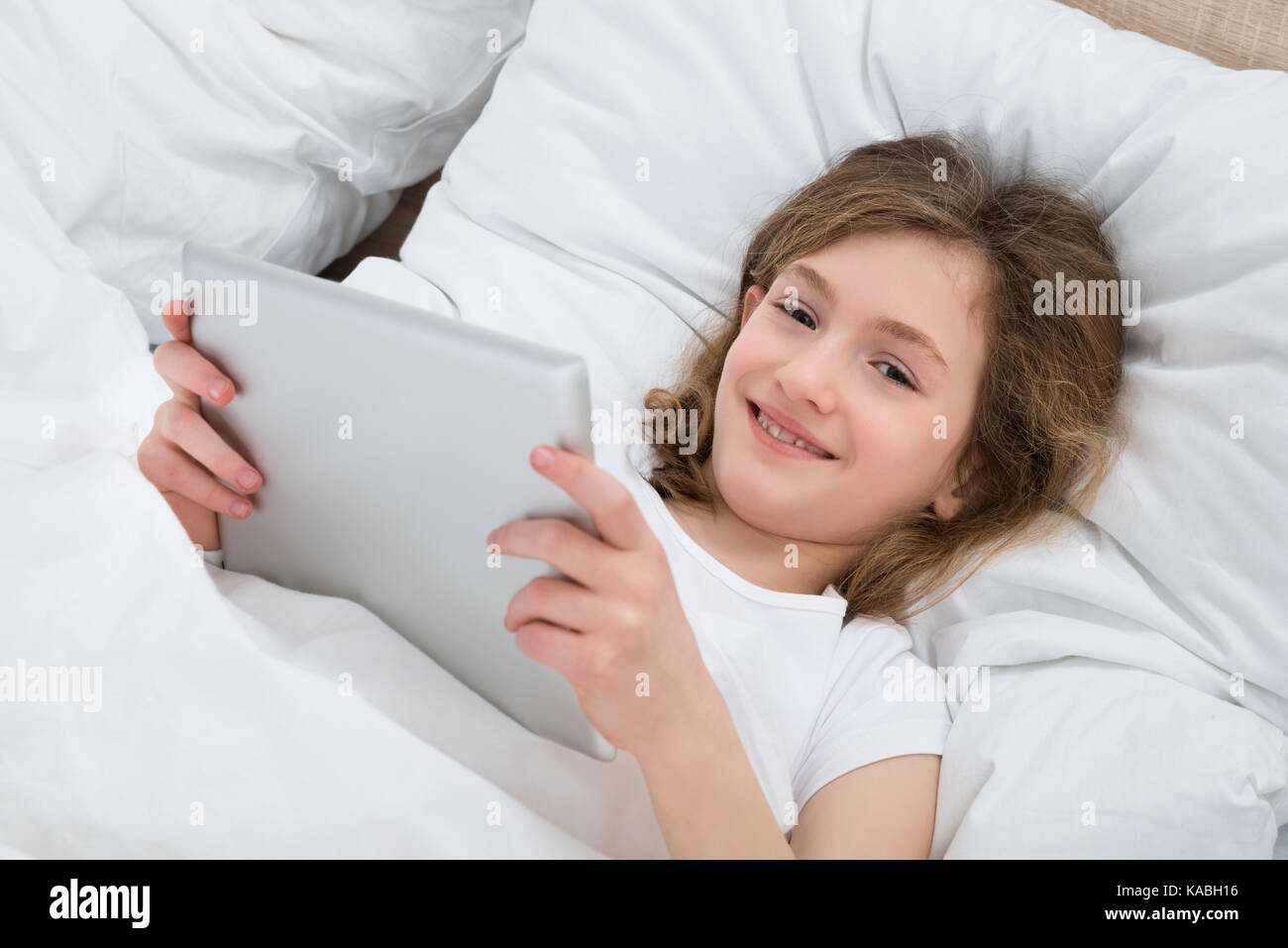 Child tablet bed hi-res stock photography and images - Alamy