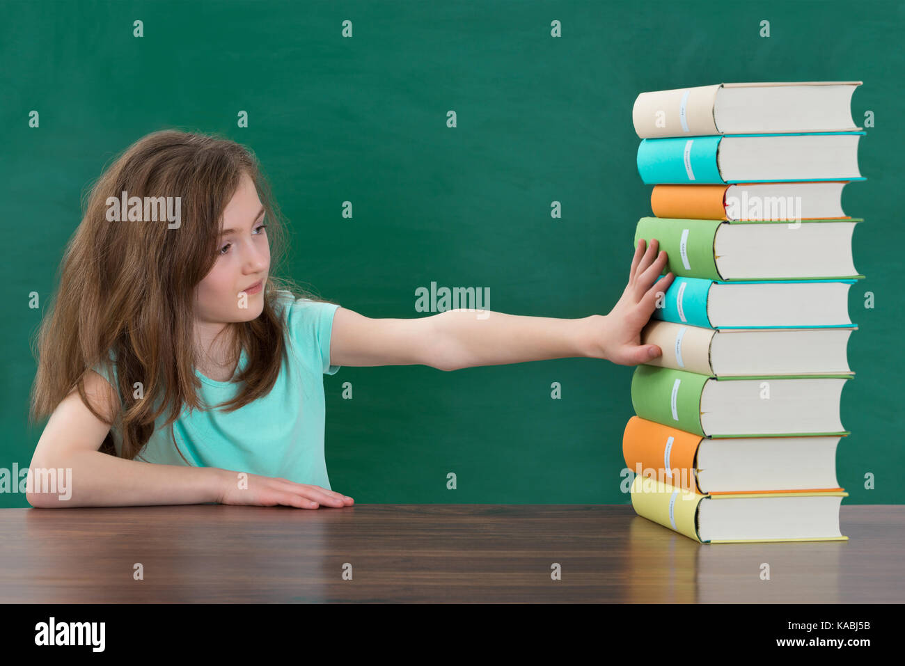 Child stack books hi-res stock photography and images - Alamy