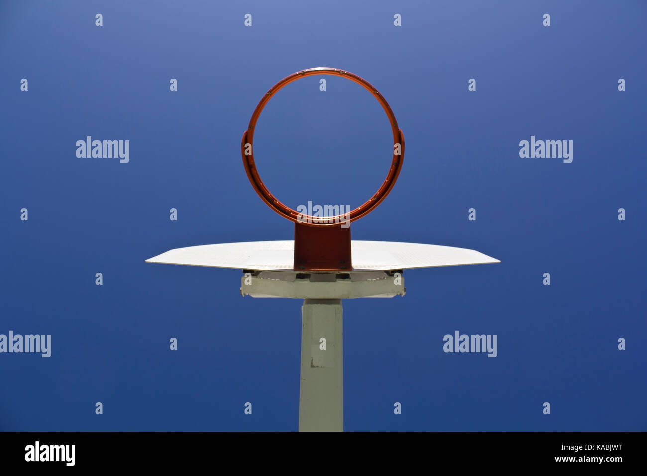 Basketball hoop bottom view on blue sky background Stock Photo - Alamy