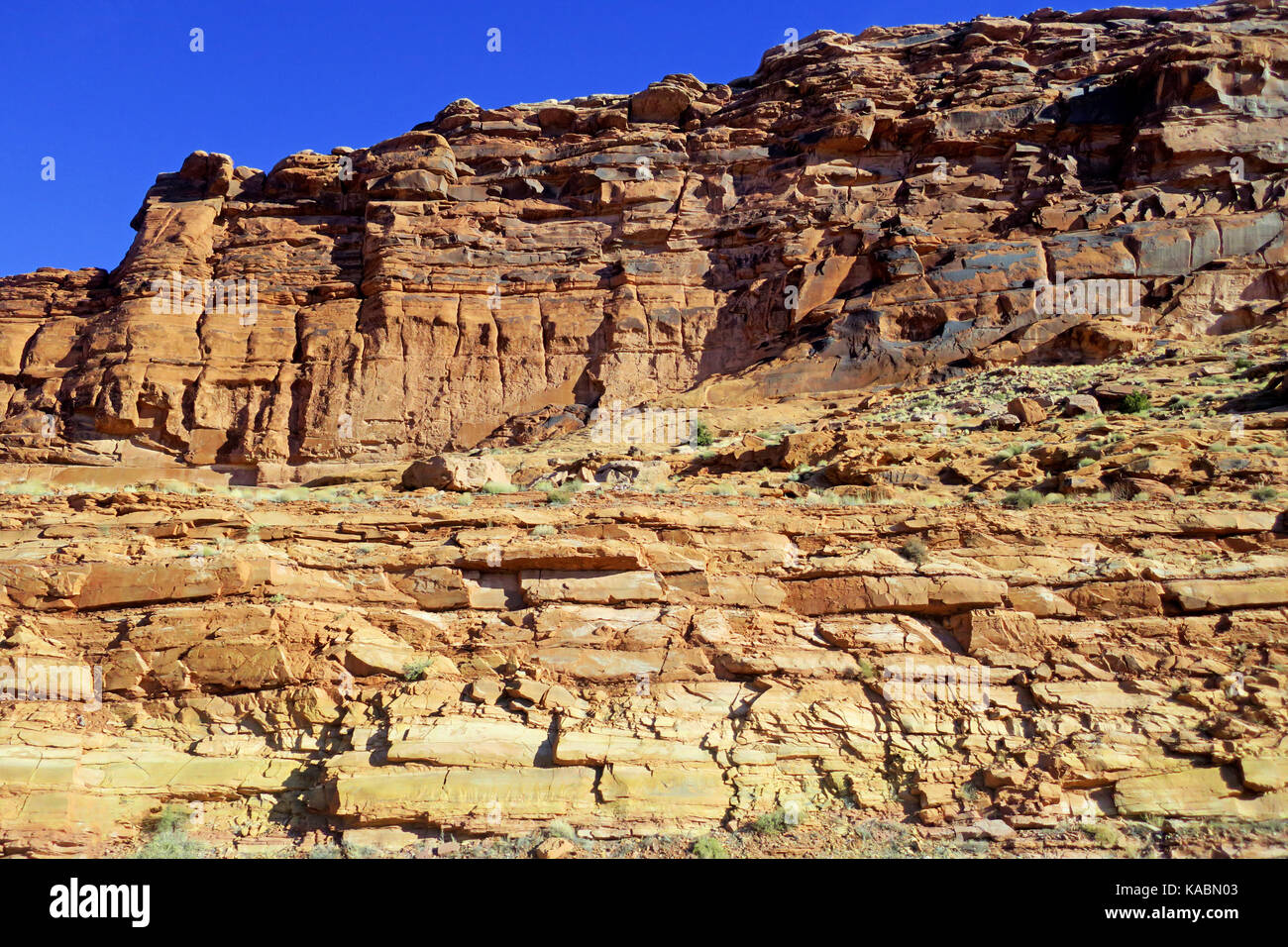 A canyon of red rock on a bright blue sky Stock Photo - Alamy