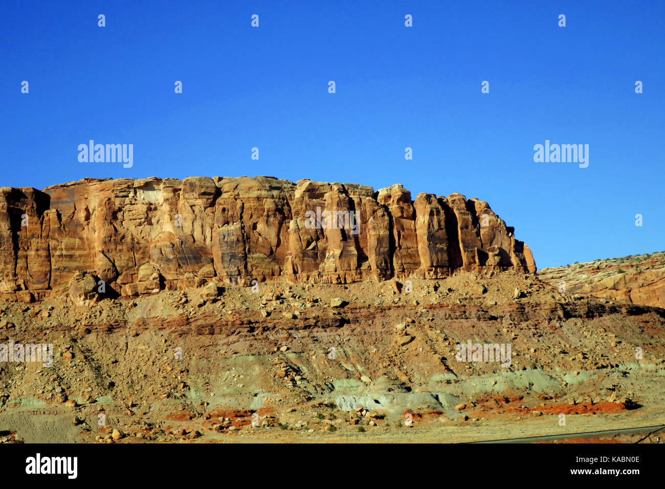 A rock formation on a bright blue sky Stock Photo - Alamy