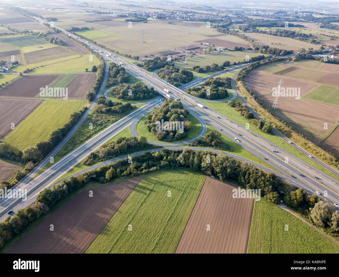 Aerial view of a highway intersection with a clover-leaf interchange ...