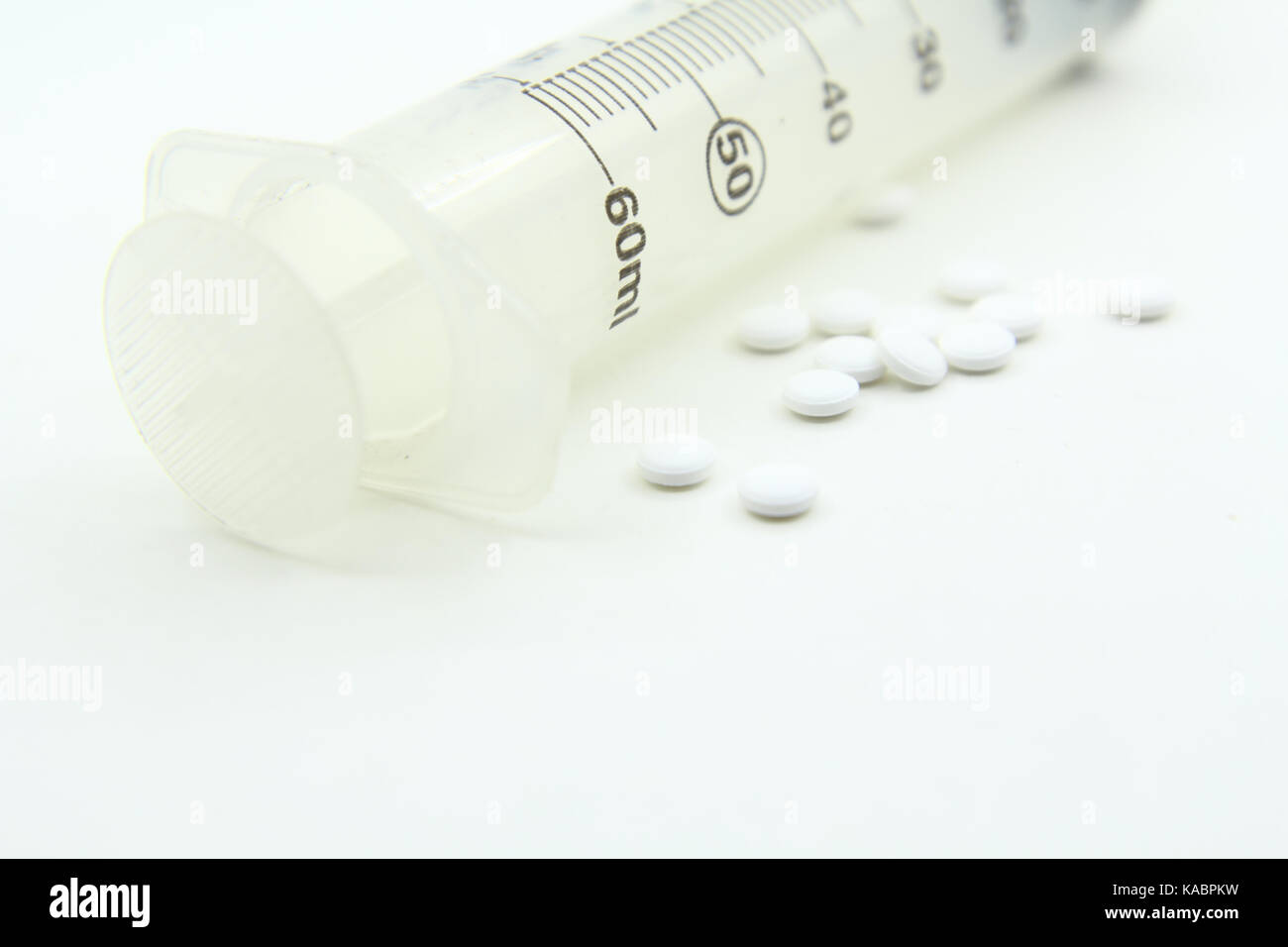 Syringe with drug on white background Stock Photo - Alamy