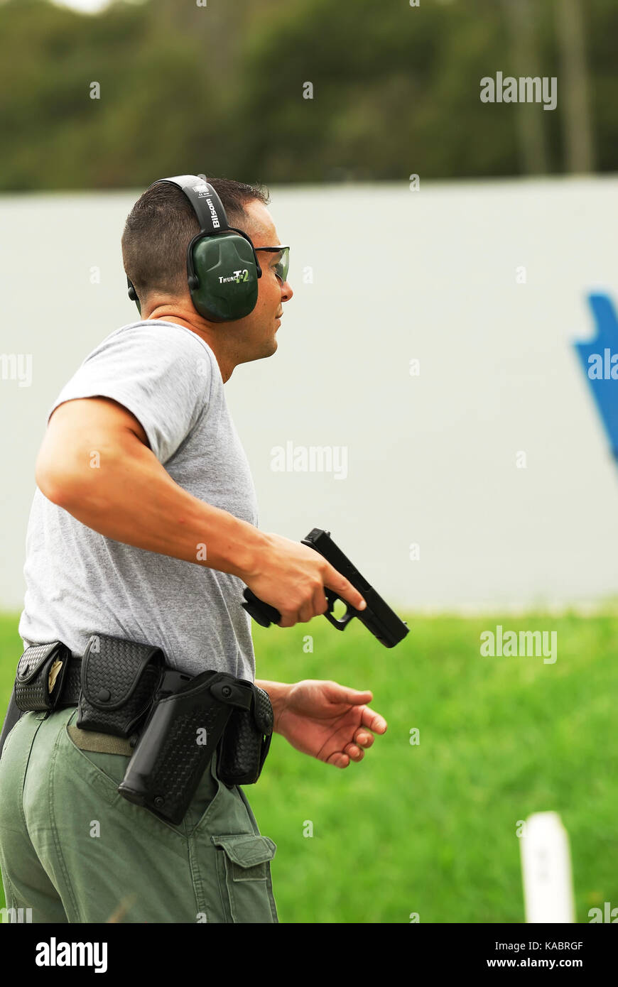 Sheriff's deputy shoots at the gun range at the law enforcement ...