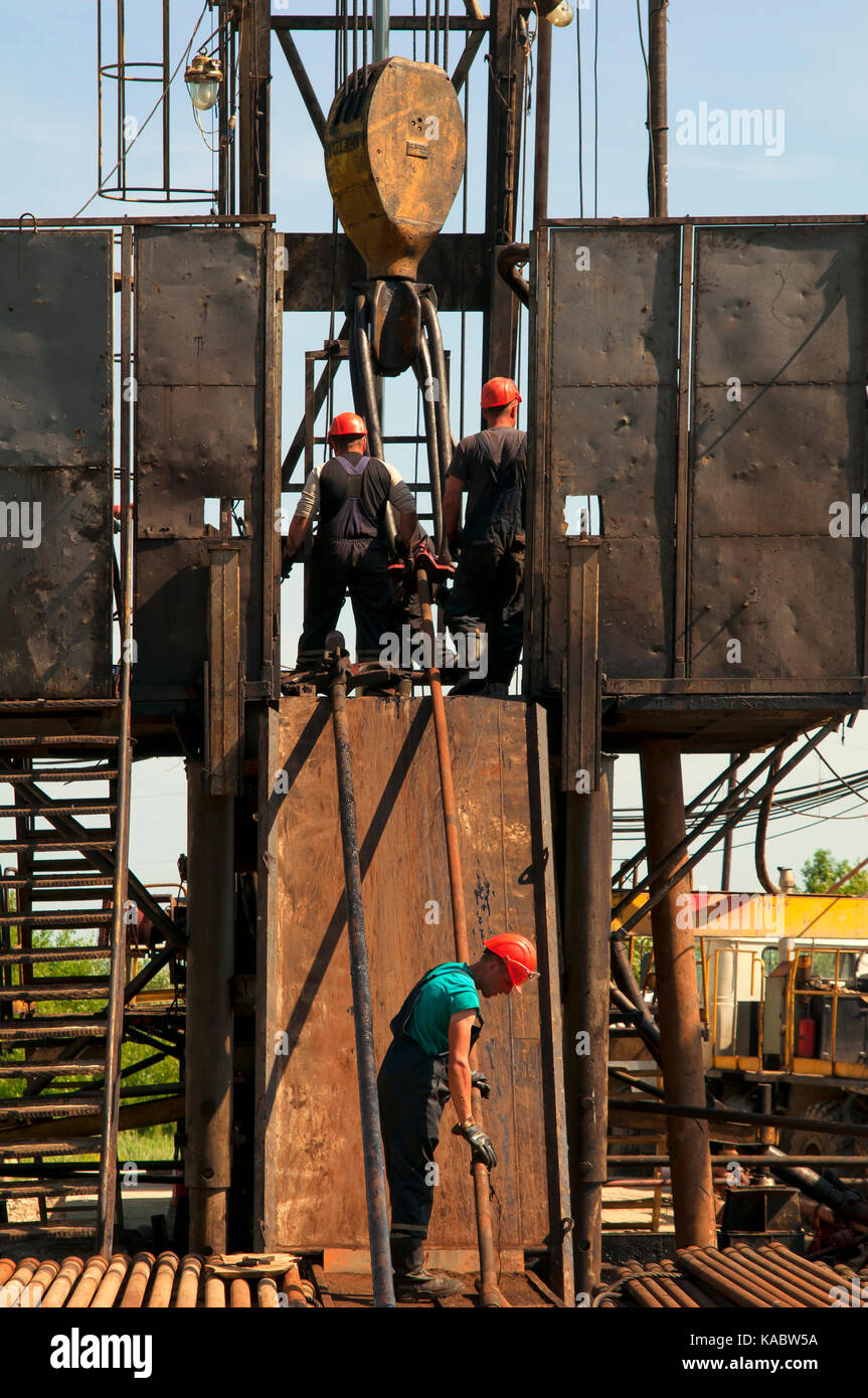 oil field, the oil workers are working Stock Photo - Alamy