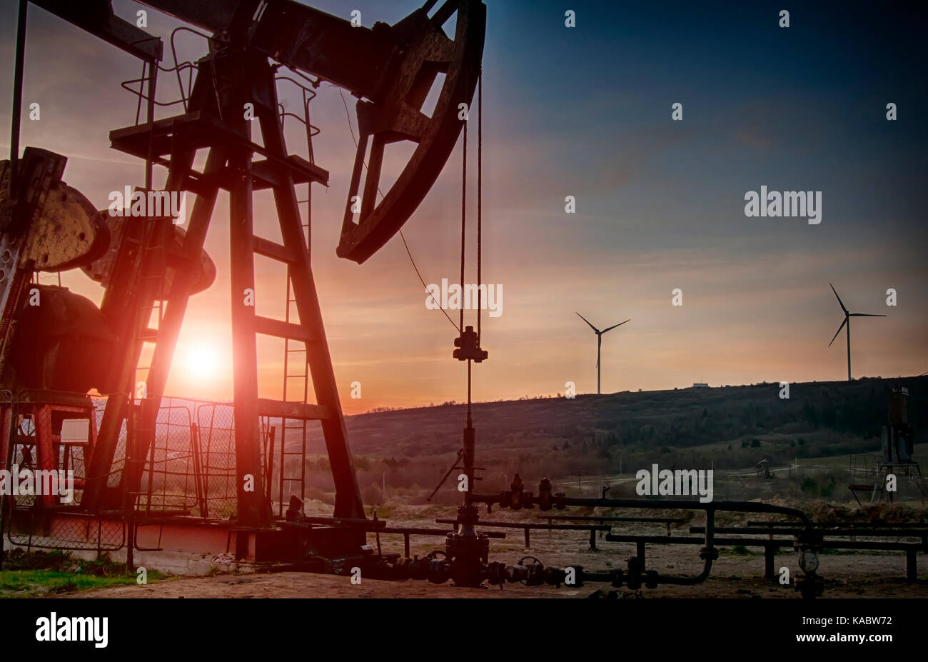 oil pump on orange sunset Stock Photo - Alamy