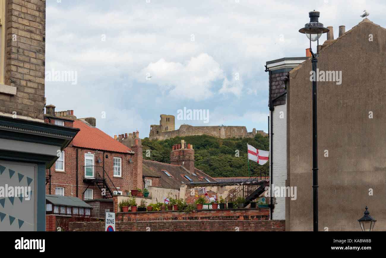 Shot of Scarborough Castle brooding above the town of Scarborough ...