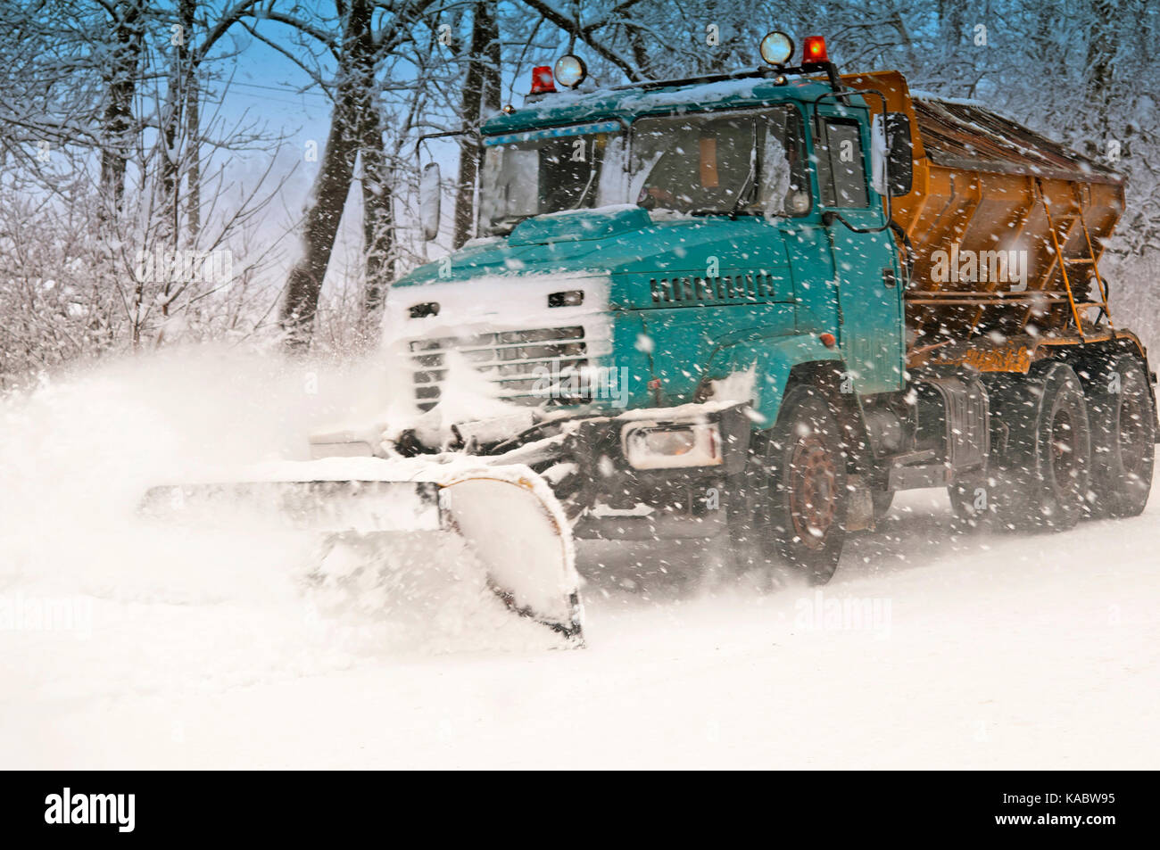 snow plow doing snow removal during blizzard Stock Photo - Alamy